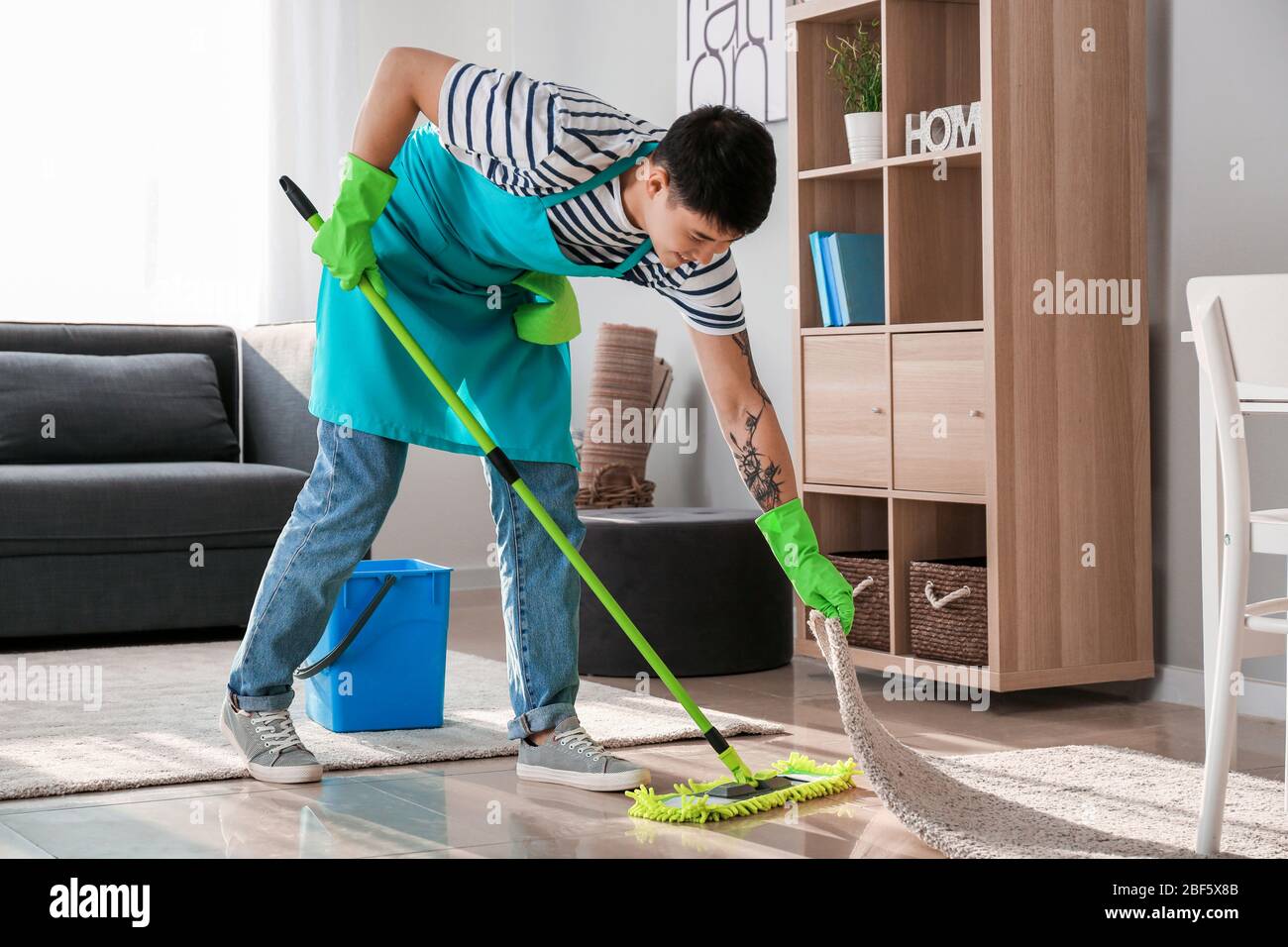 Young asian cleaning floor hi-res stock photography and images - Alamy