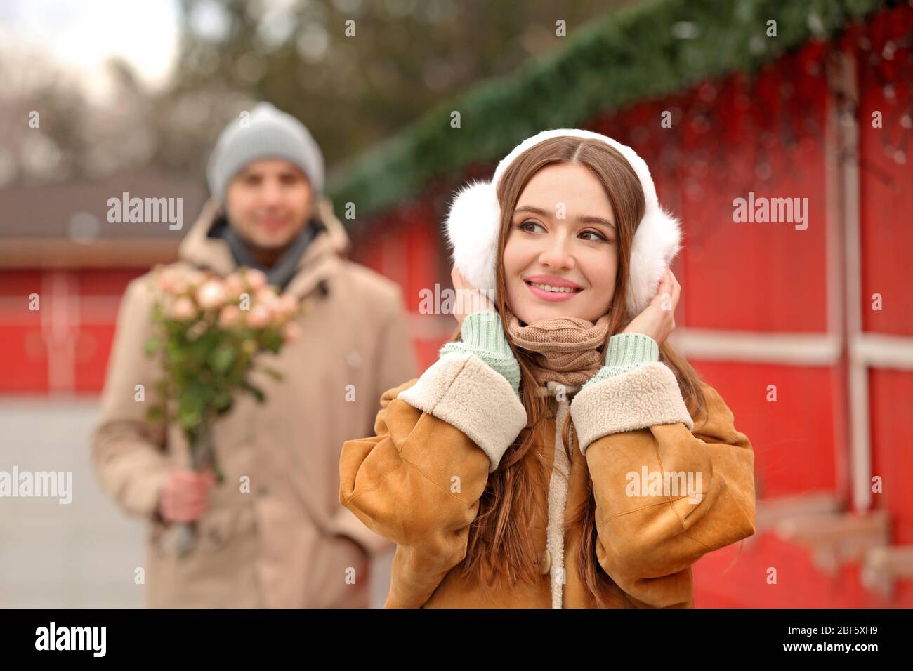 Beautiful young woman waiting for her boyfriend outdoors Stock Photo ...