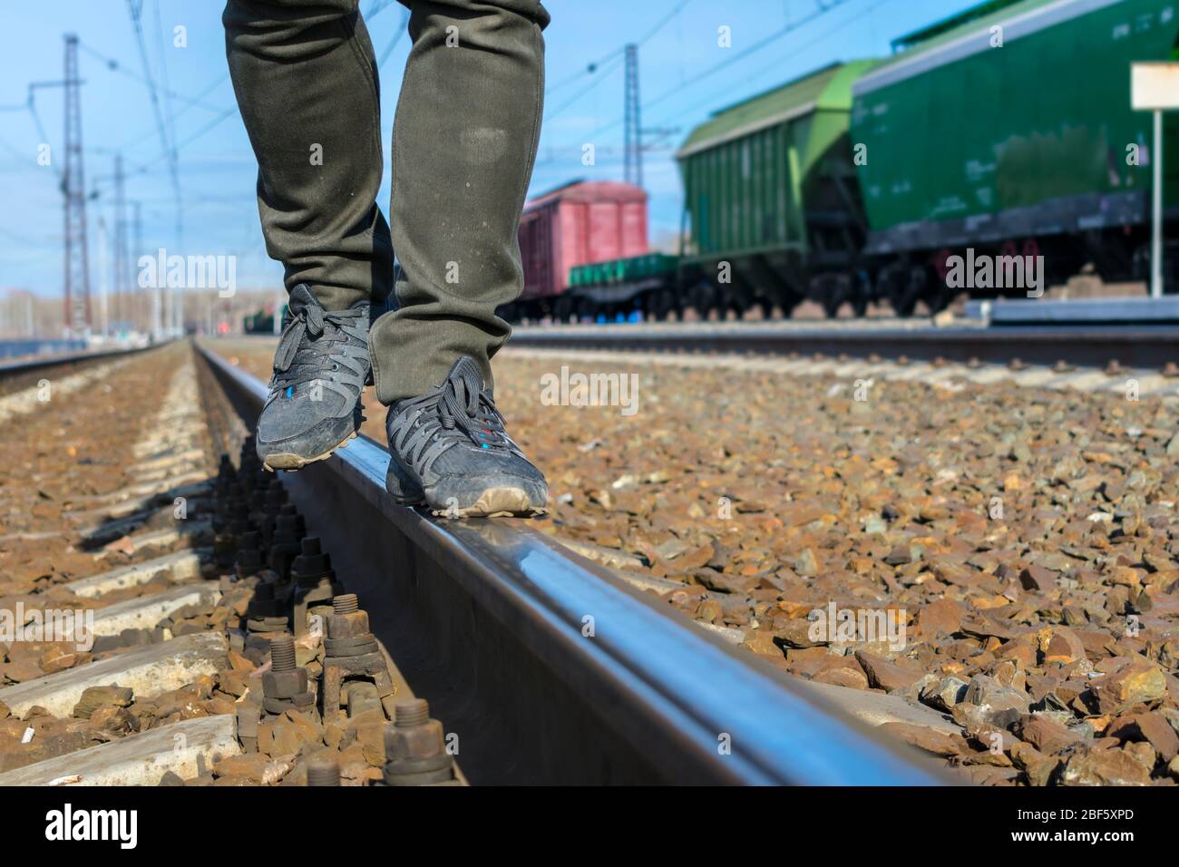 Man walking along railway track hi-res stock photography and images - Alamy