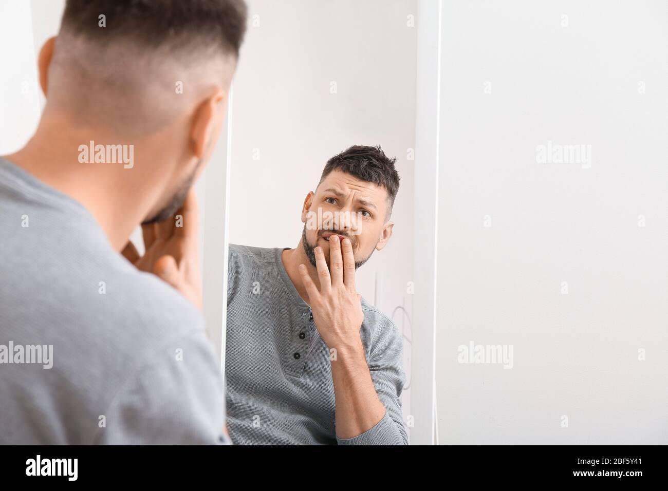 Beauty mirror sad man hi-res stock photography and images - Alamy