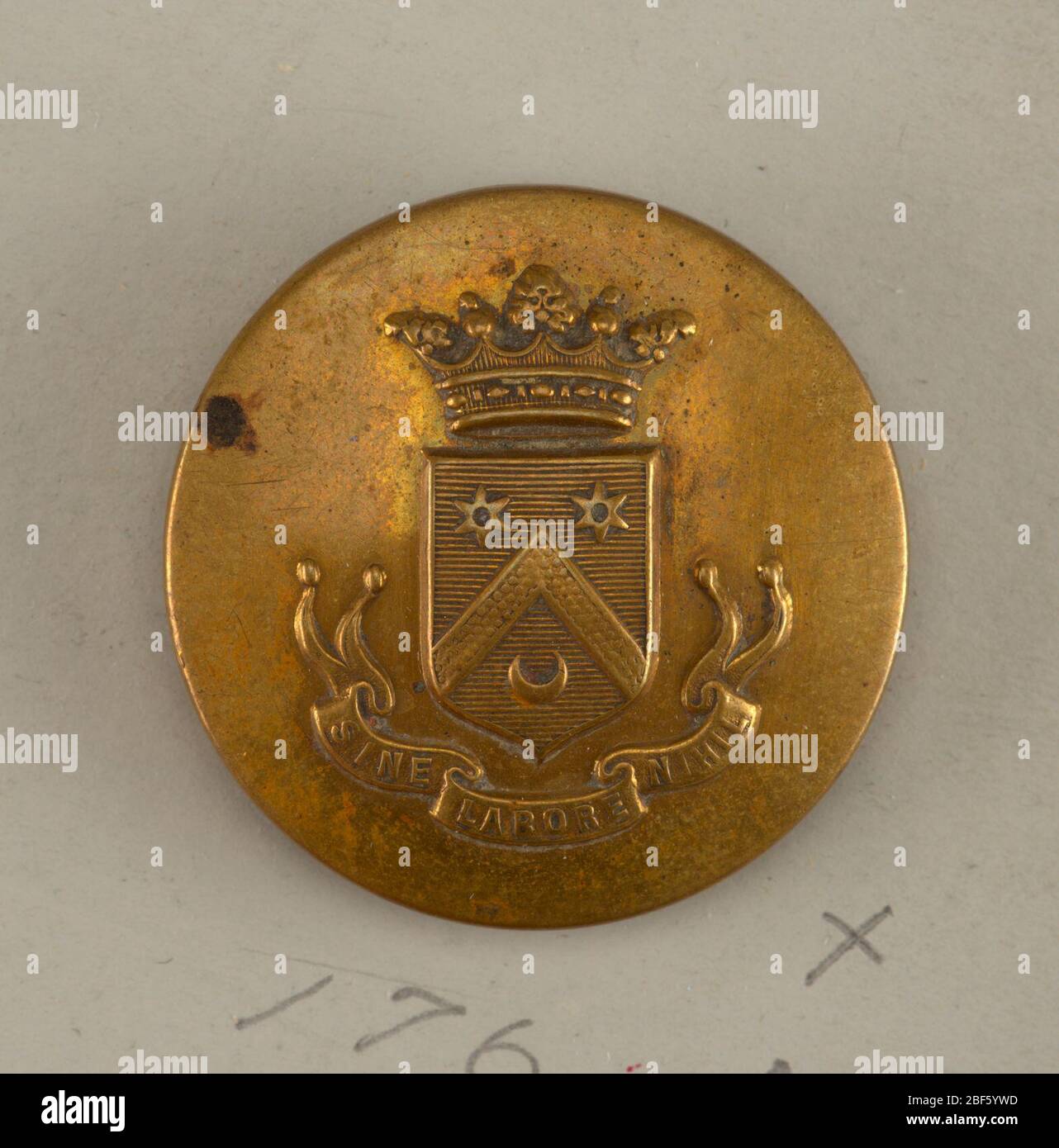 Button. slightly convex button showing a shield with heraldic devices ...