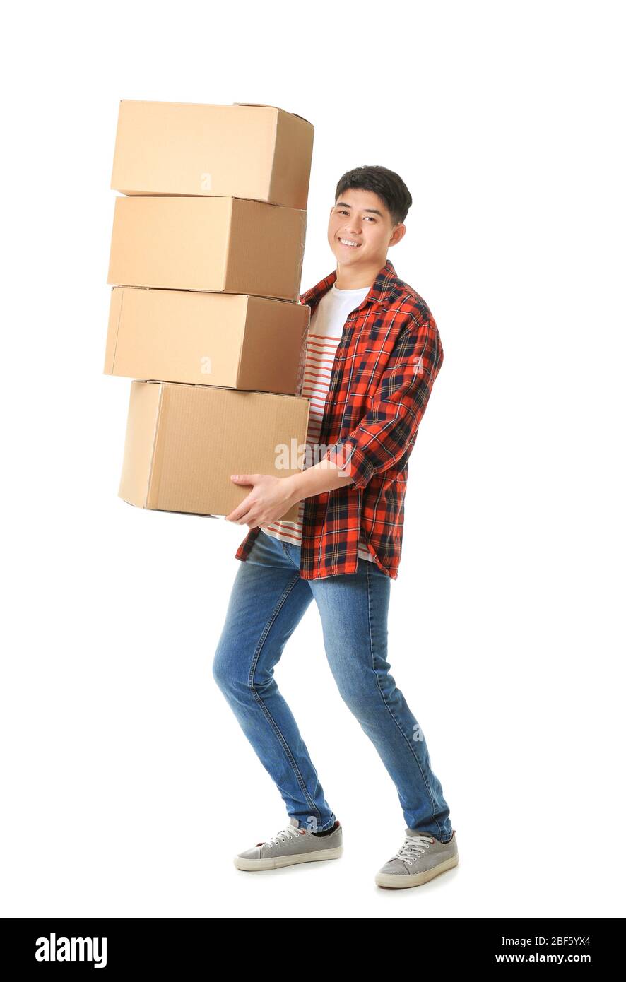 Asian man with moving boxes on white background Stock Photo - Alamy