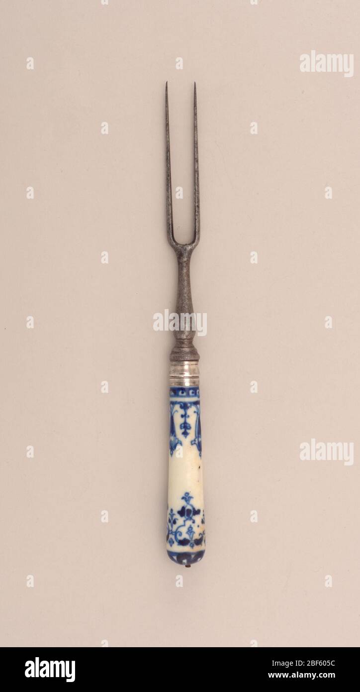 Fork. Two long curved tines, rounded shoulders, baluster-shaped neck ...