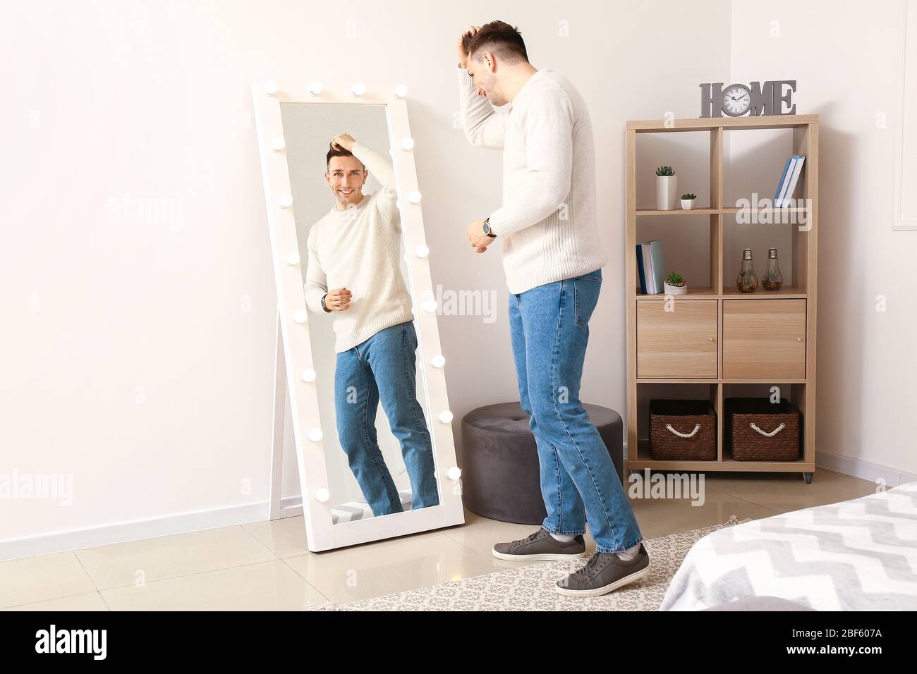 Positive guy looking mirror hi-res stock photography and images - Alamy