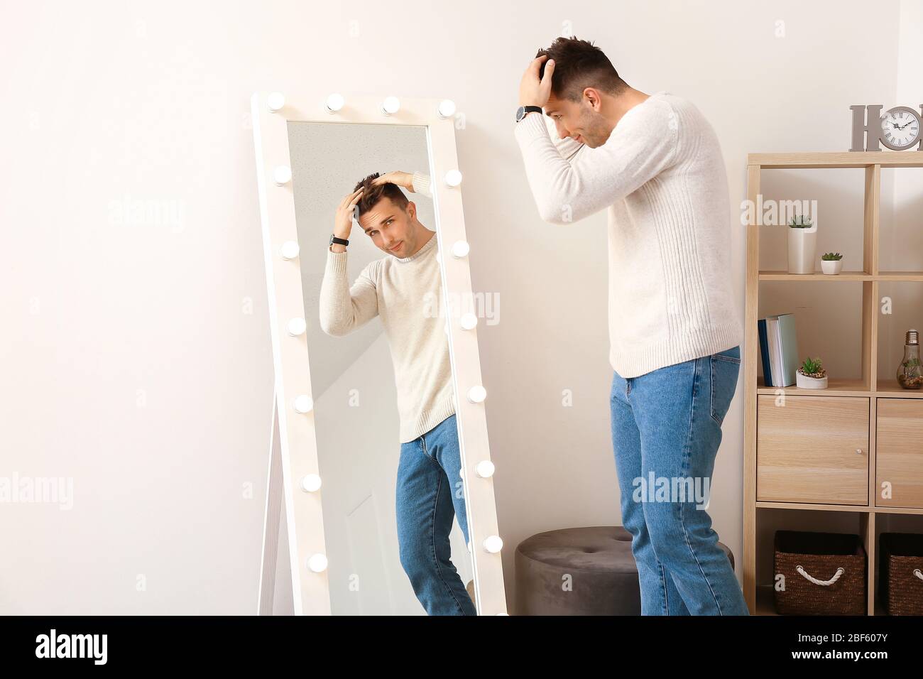 Positive guy looking mirror hi-res stock photography and images - Alamy