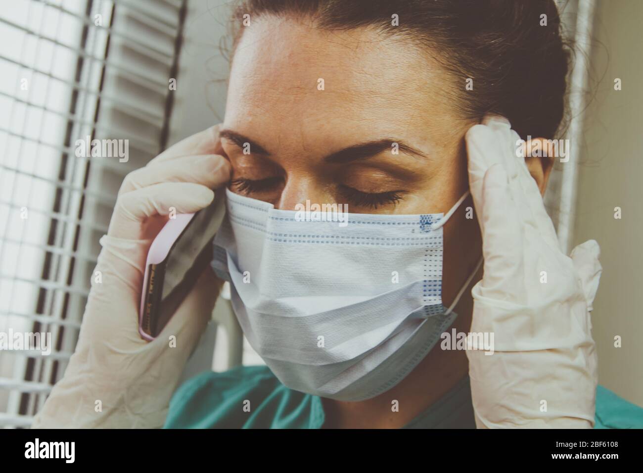 Italian Tired exhausted doctor with medical surgical mask on her Face ...