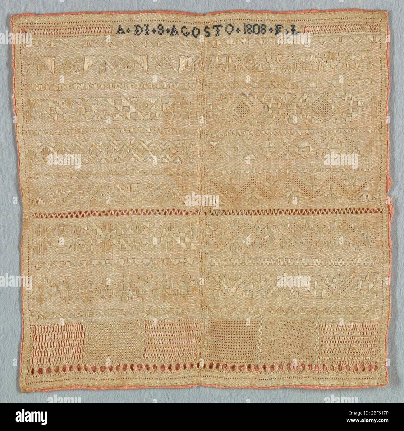 Sampler. Small white work sampler with two columns of pattern bands in ...