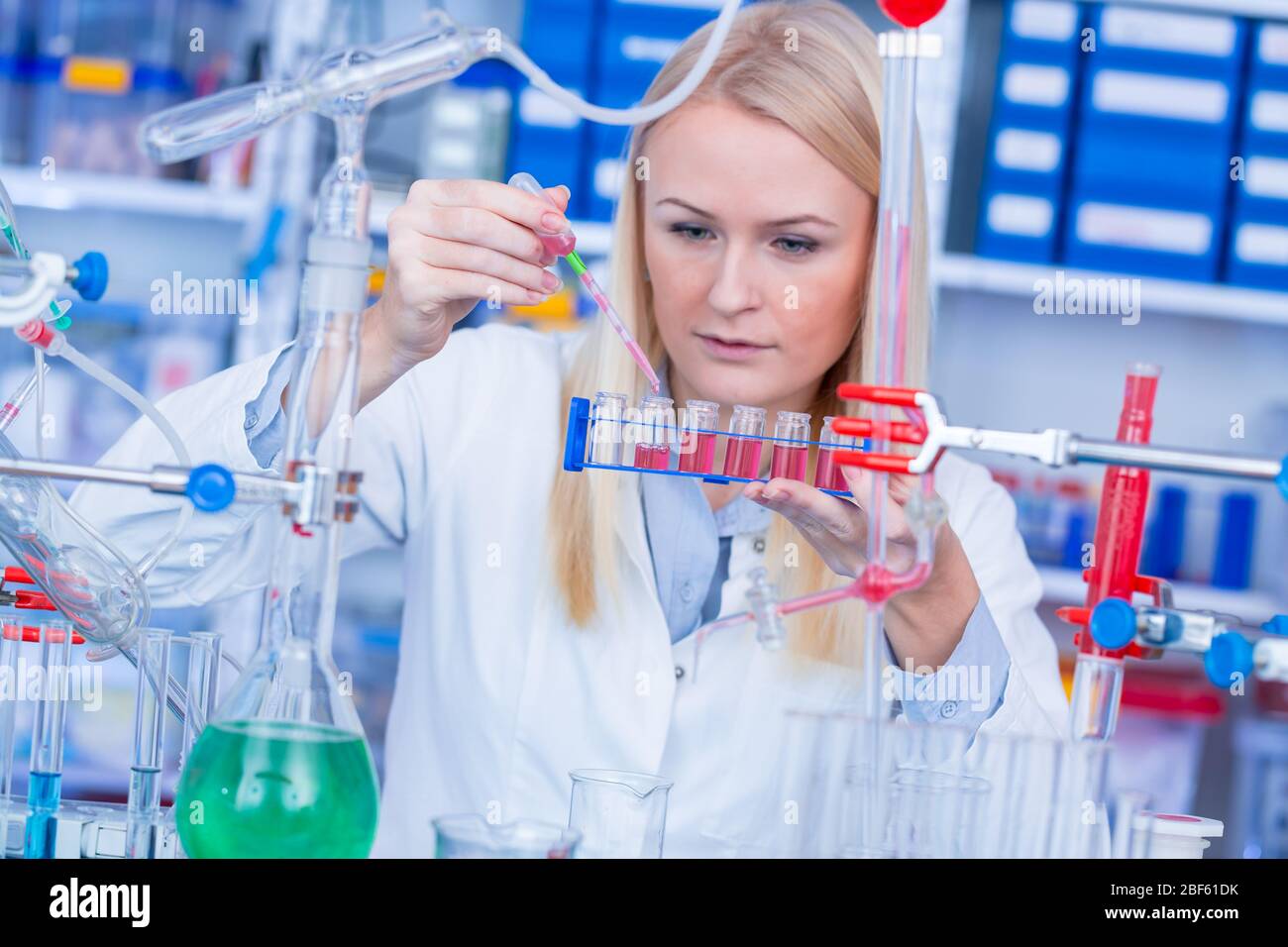 Girl laboratory Assistant works with an antiviral drug in a ...