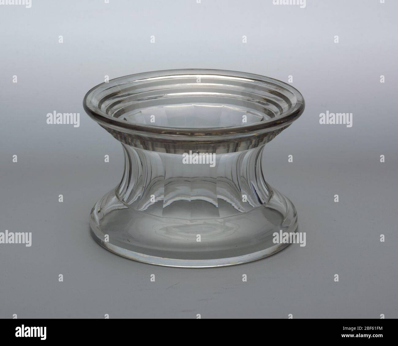Bowl and stand. Spool-shaped with vertical fluting around center ...