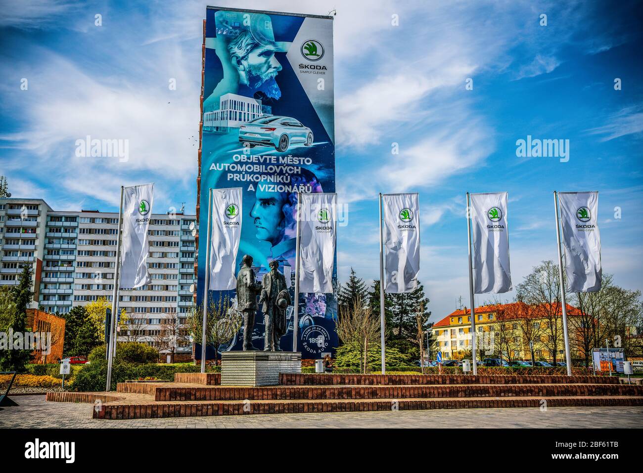 Flags of Czech carmaker Skoda Auto fly in the wind behind statue of ...