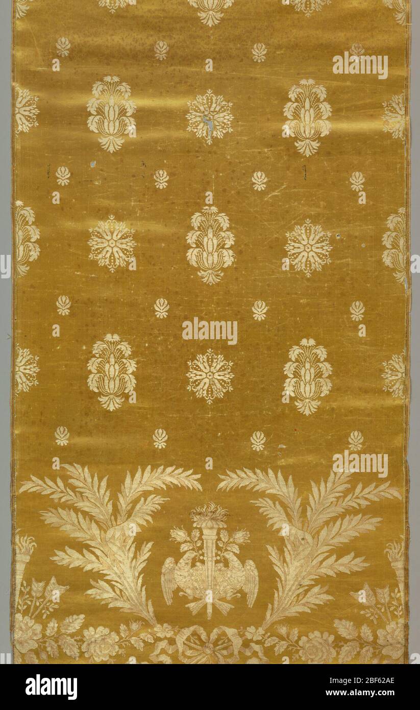 Textile. Pale yellow satin with fairly wide set vertical/horizontal ...