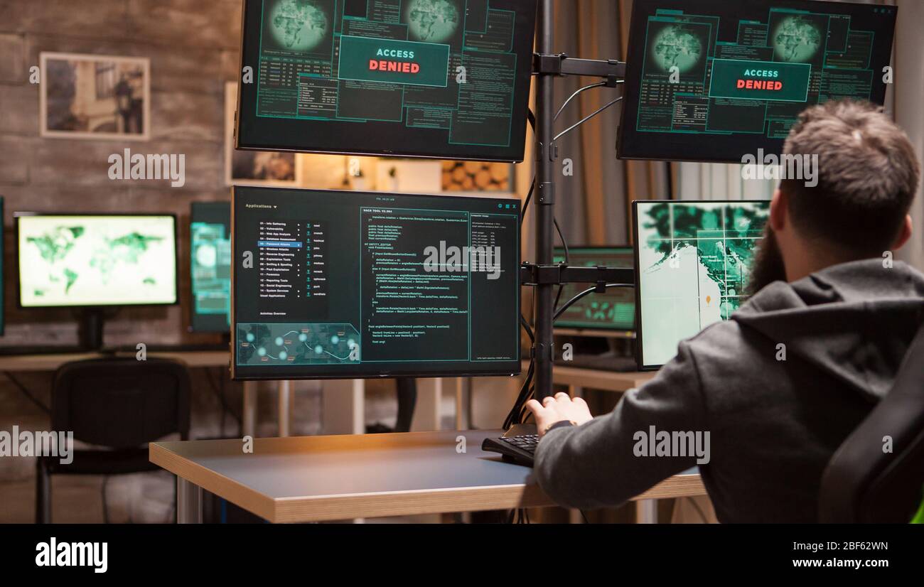 Back View Of Male Hacker Gets Access Denied While Trying To Plant A