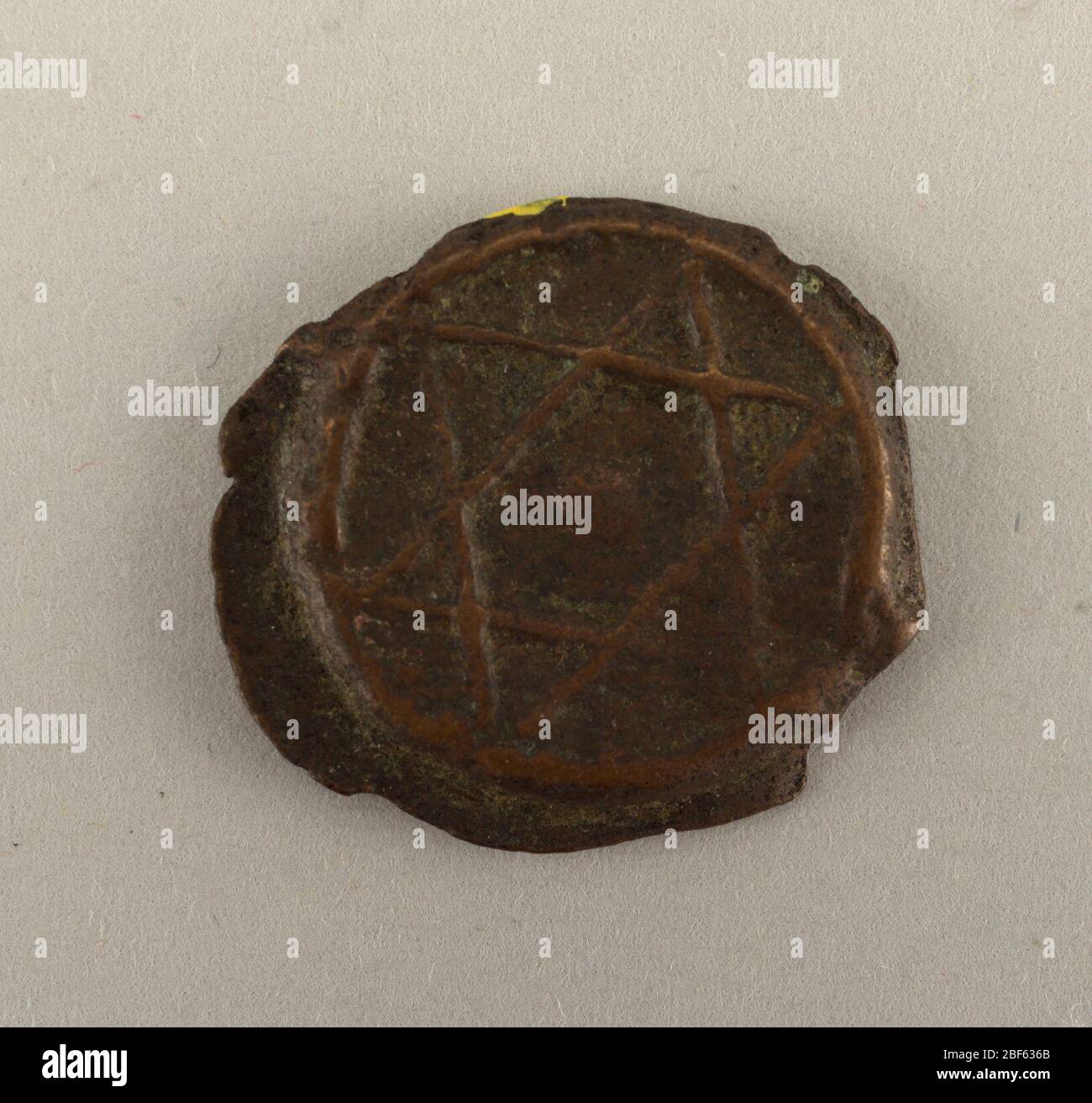 Falus coin. Irregular edge. Six pointed star with raised dot at center ...