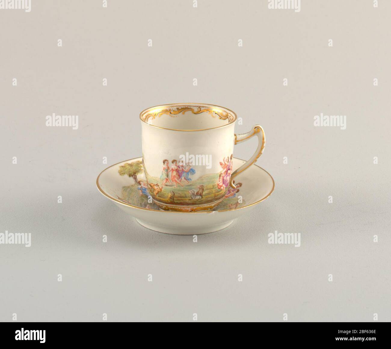 Cup and saucer. Curved, tall cup, with slightly flaring edge. Saucer ...
