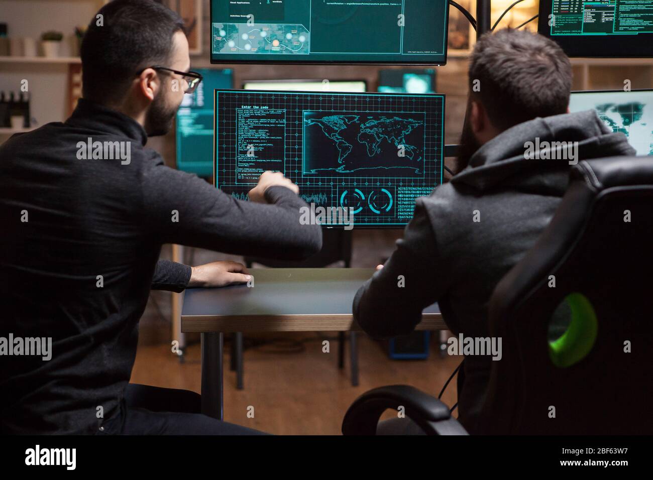 Team of hackers planning a cyber attack using a dangerous malware Stock ...