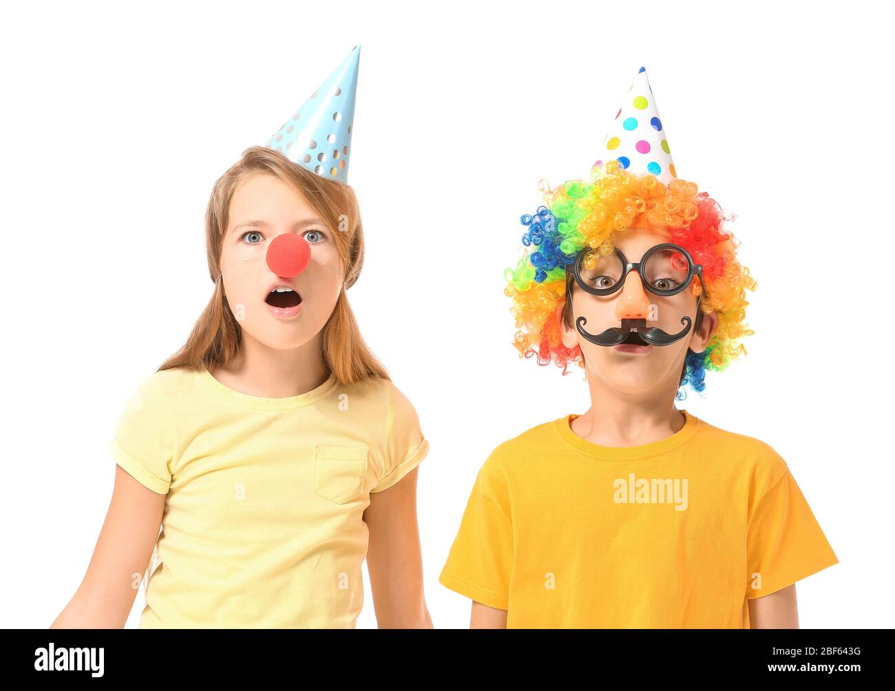 Shocked little children in funny disguise on white background. April ...