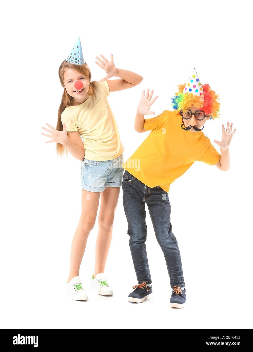 Little children in funny disguise on white background. April fools' day ...