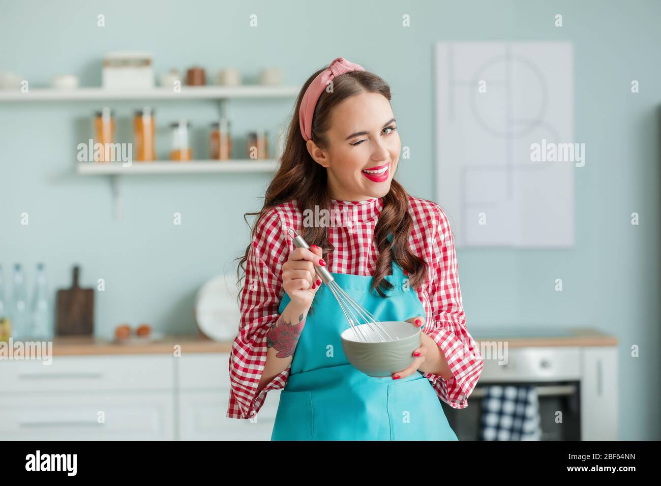 Beautiful housewife cooking in kitchen Stock Photo - Alamy