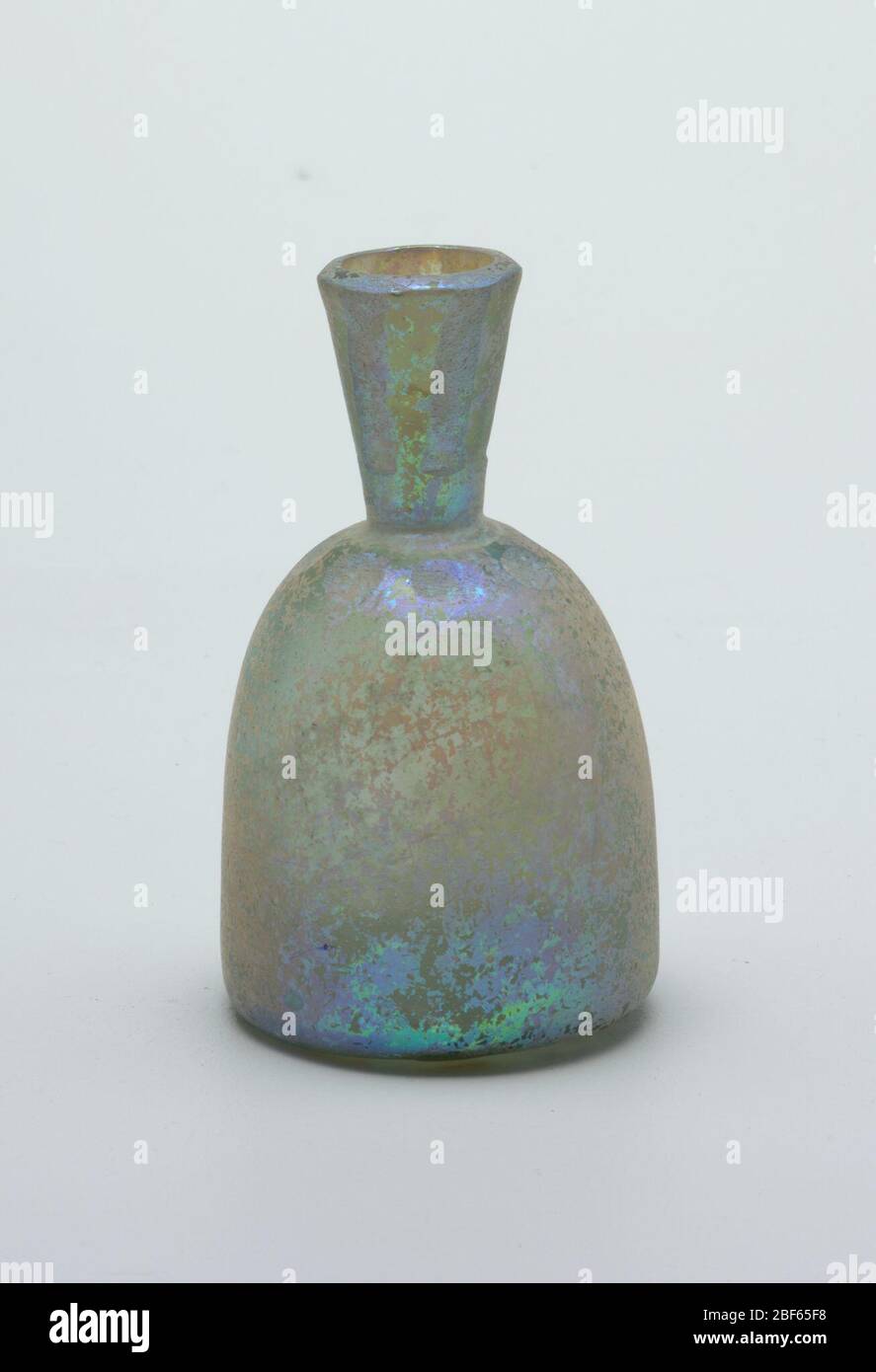 Vase. Vessel of bulbous form with flared neck. Light Green glass ...