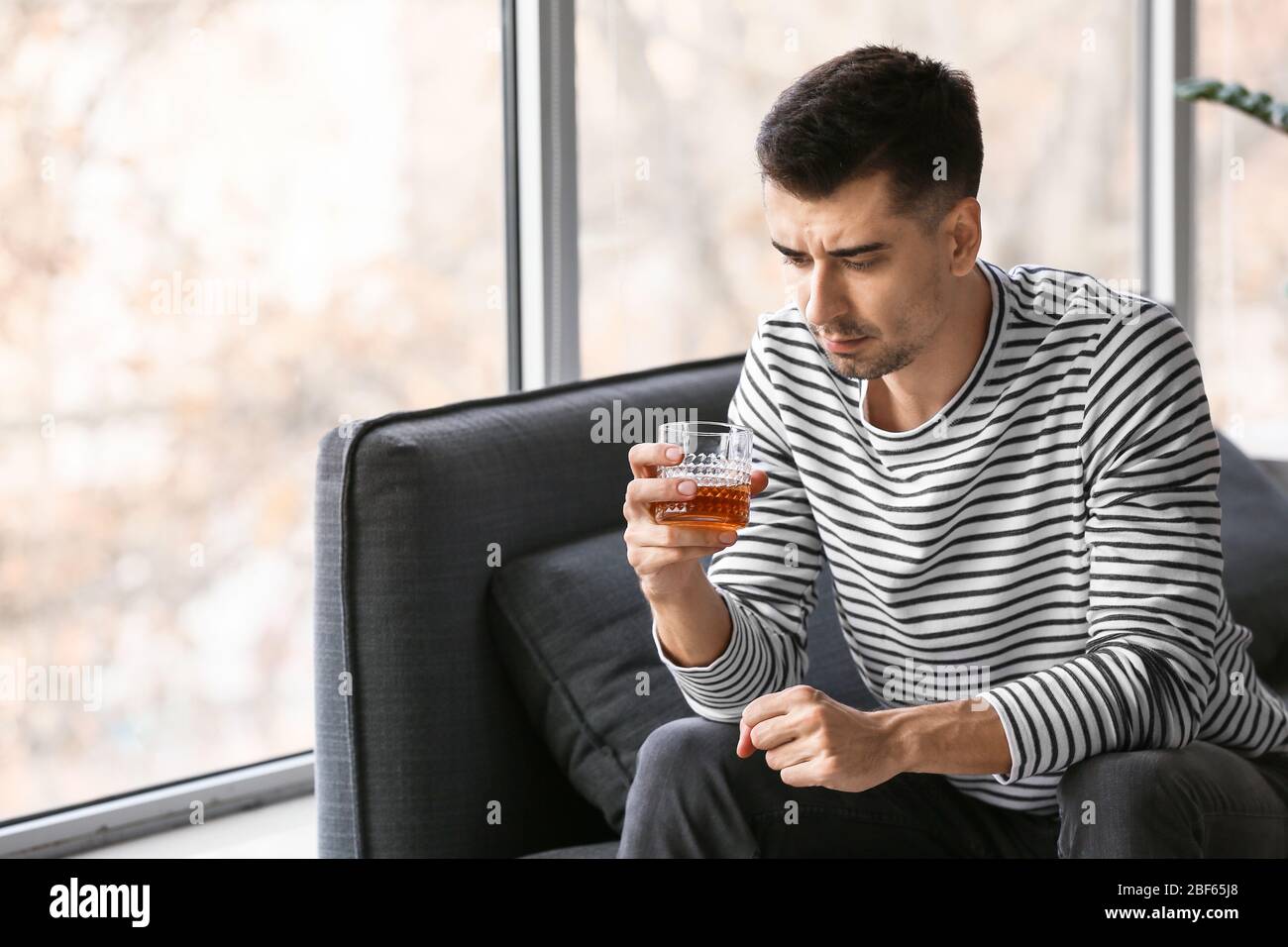 Man drinking alcohol at home hi-res stock photography and images - Alamy