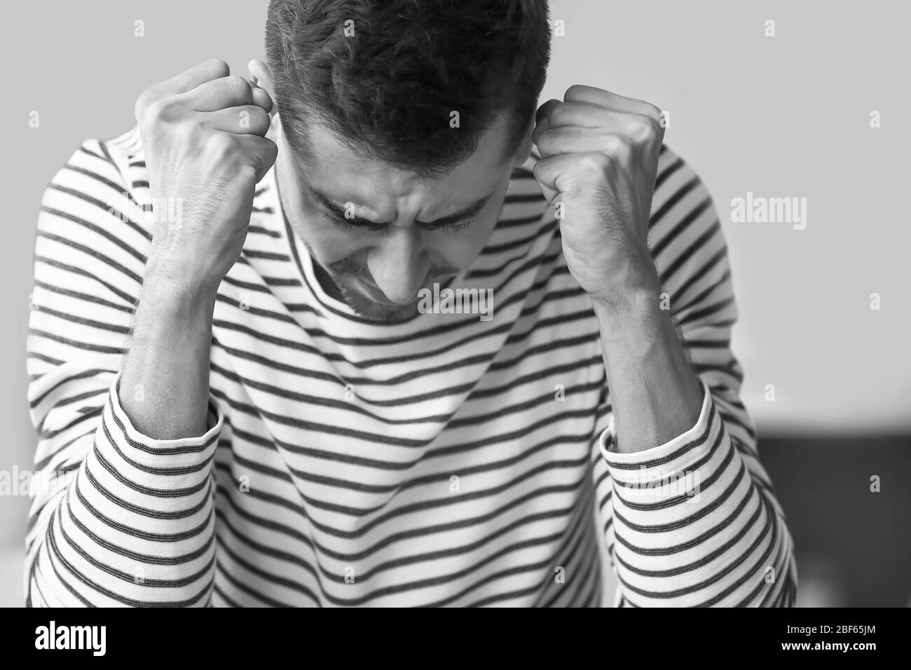 Black and white portrait of depressed young man at home Stock Photo - Alamy