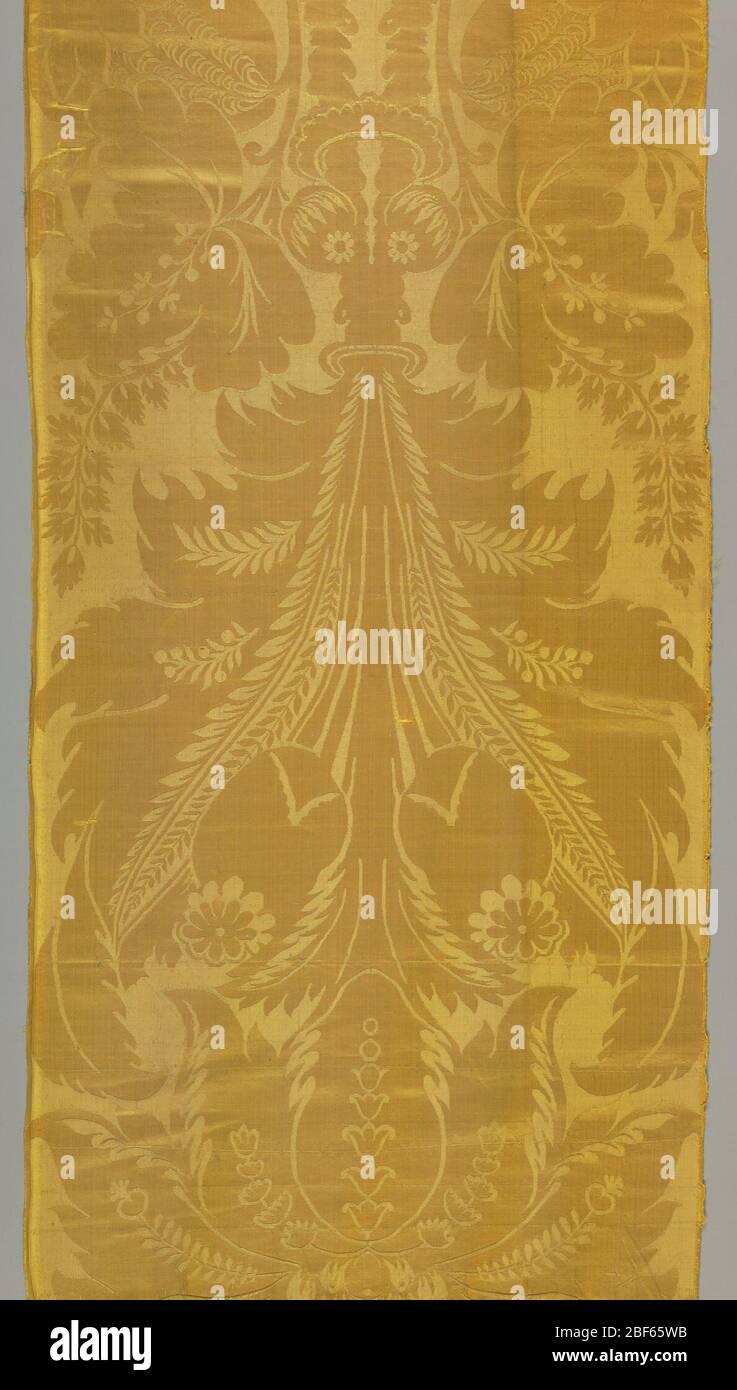 Textile. Yellow damask with a very bold, large-scale, vertically ...