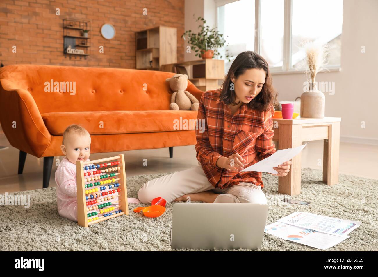 Working mother with her baby at home Stock Photo - Alamy