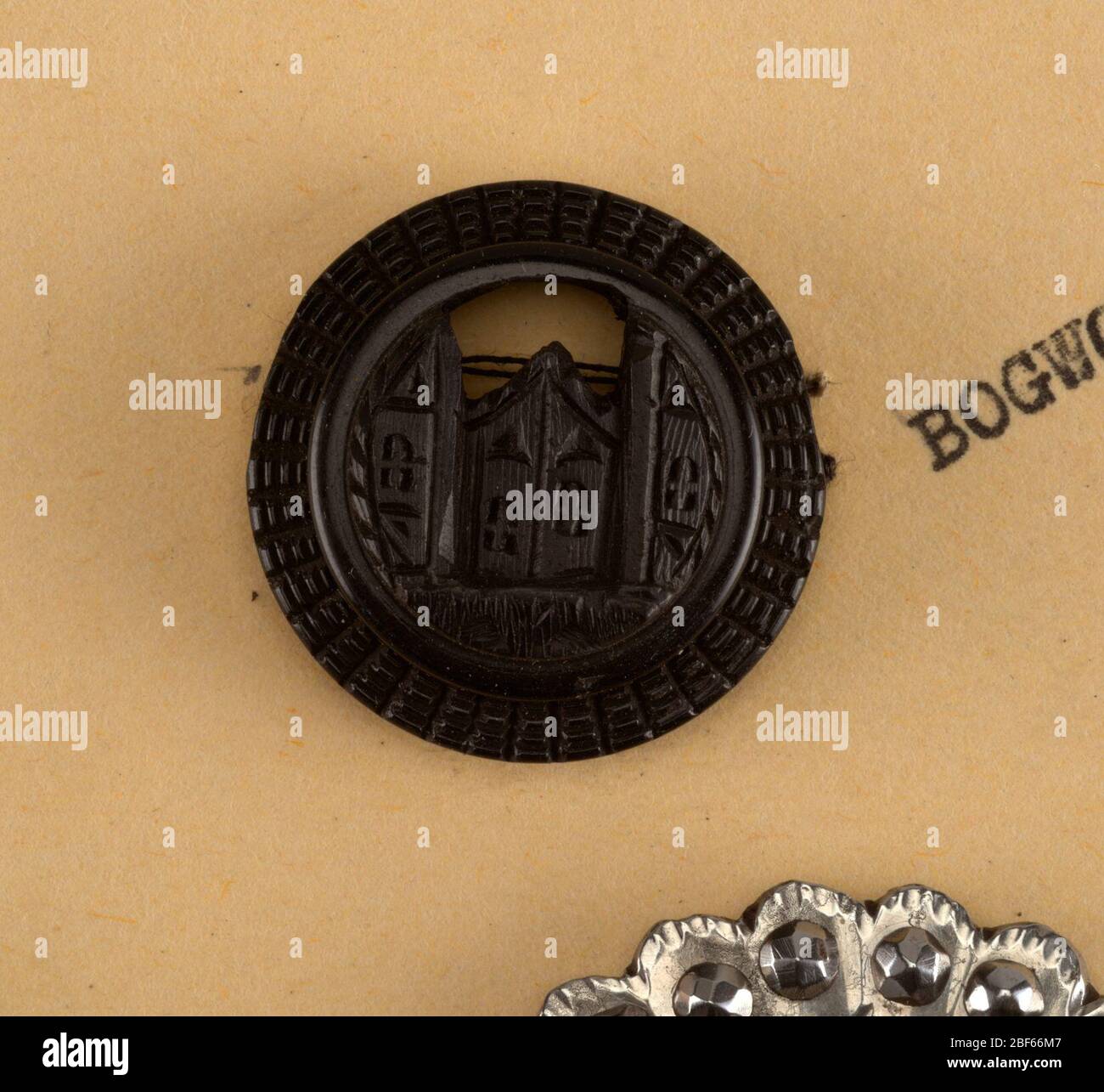 buttons 5. each of the five circular buttons is pierced in under side ...