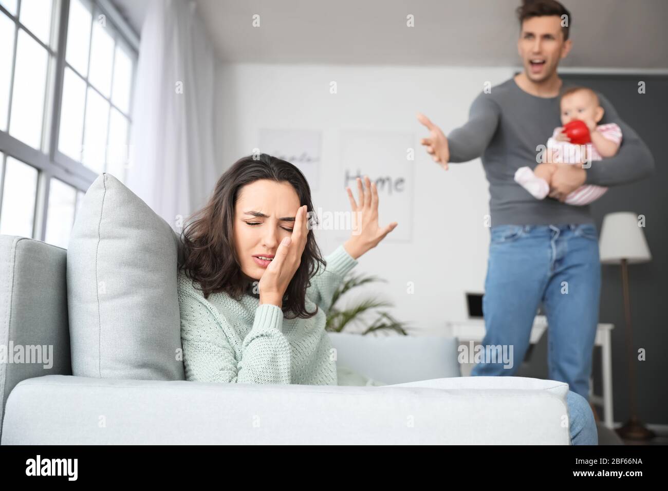 Stressed couple suffering from postnatal depression at home Stock Photo ...