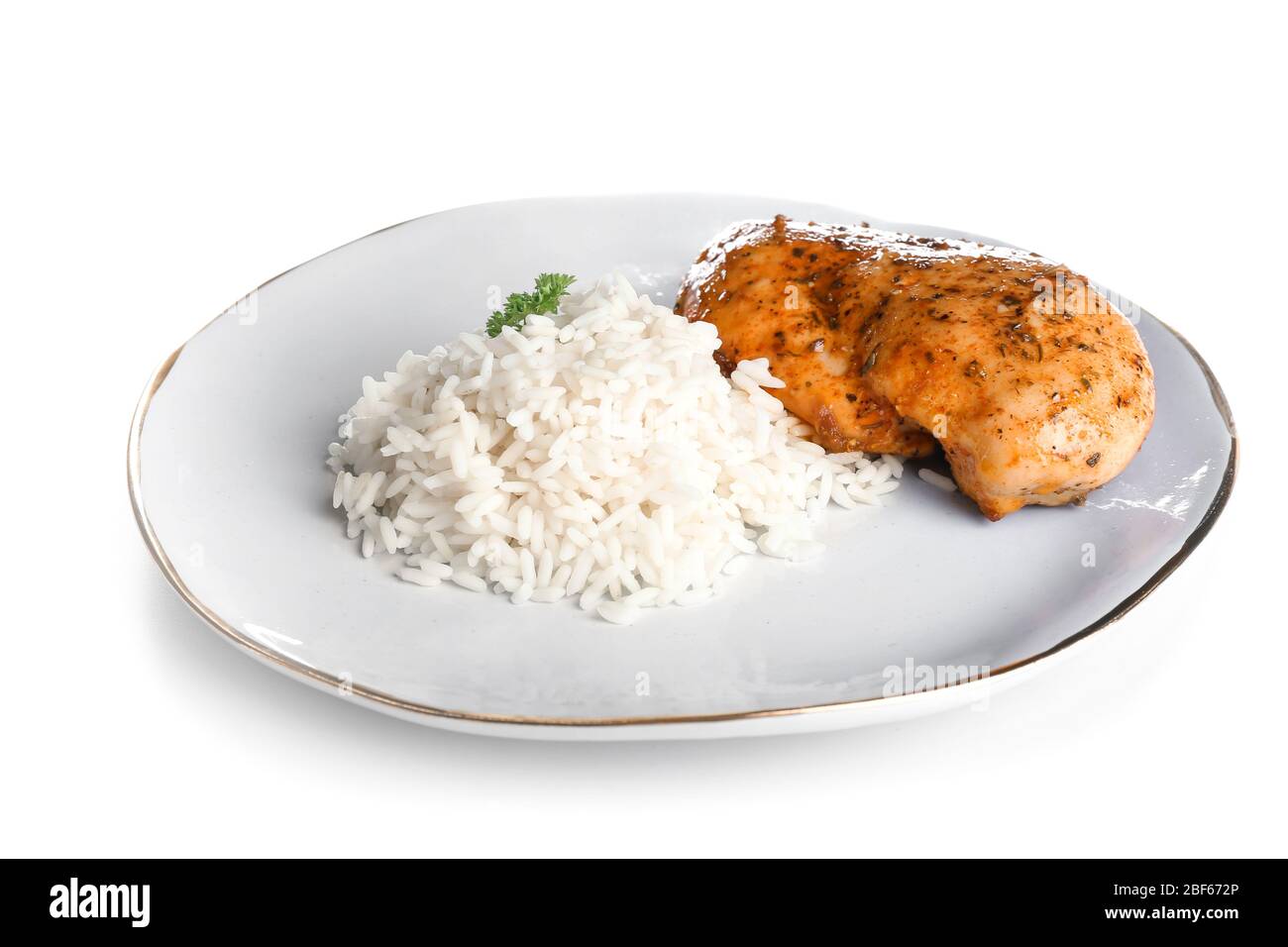 Plate with tasty rice and chicken on white background Stock Photo - Alamy