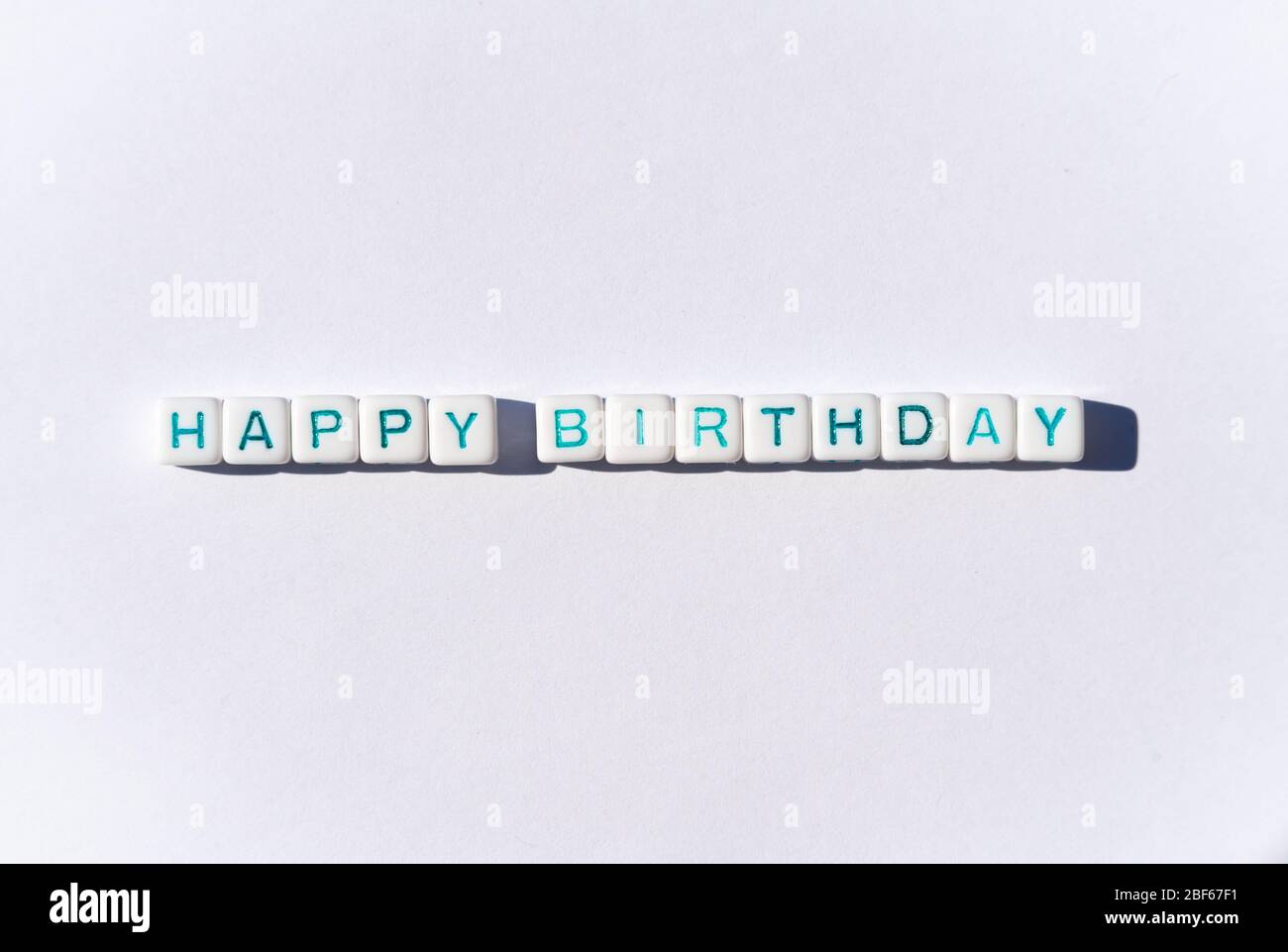 Happy Birthday postcard with cubes with blue letters on white ...