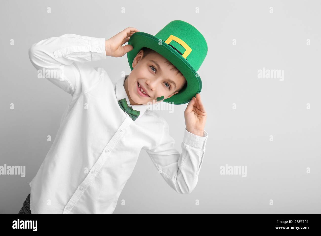 Funny little boy on white background. St. Patrick's Day celebration ...