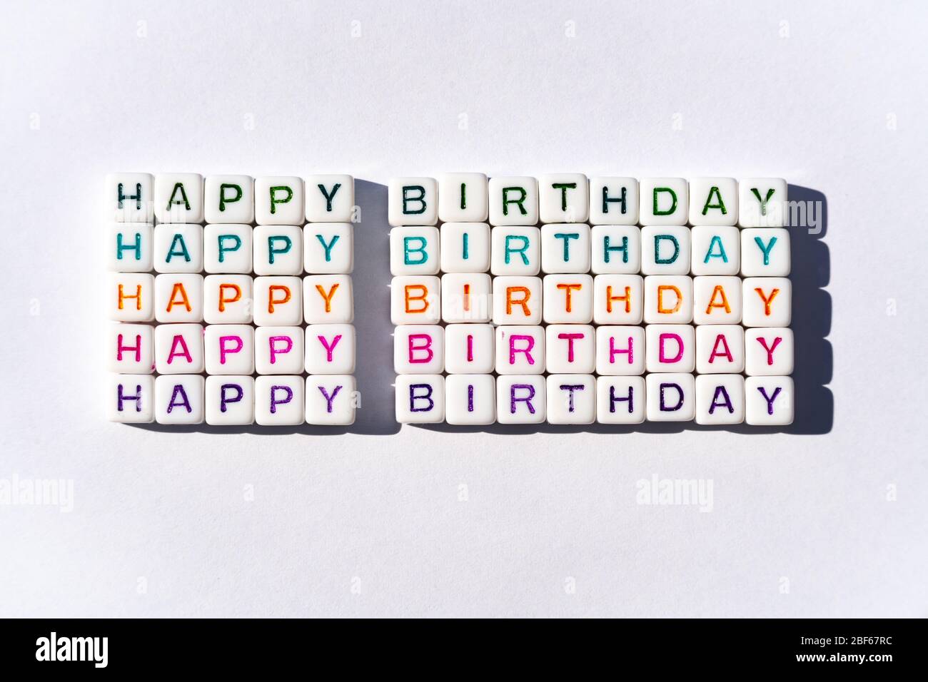 Happy Birthday postcard with cubes in various colors on white ...