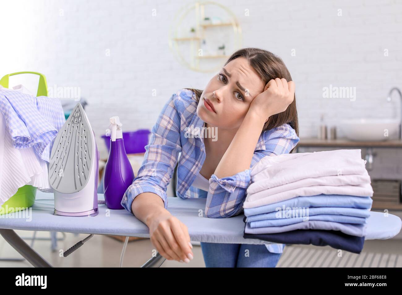 Tired housewife laundry home hi-res stock photography and images - Alamy