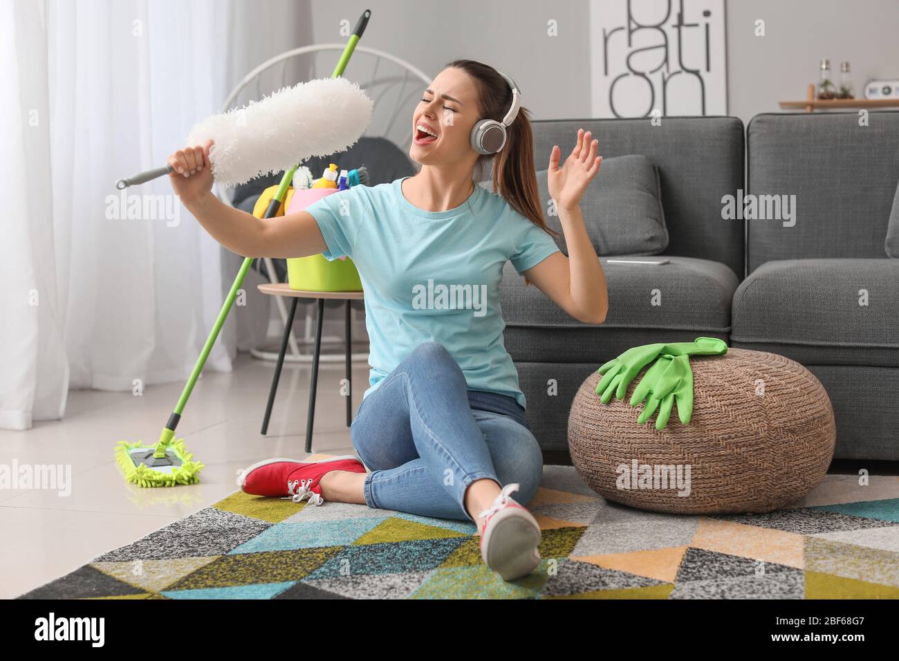 Young housewife having fun while cleaning her flat Stock Photo - Alamy