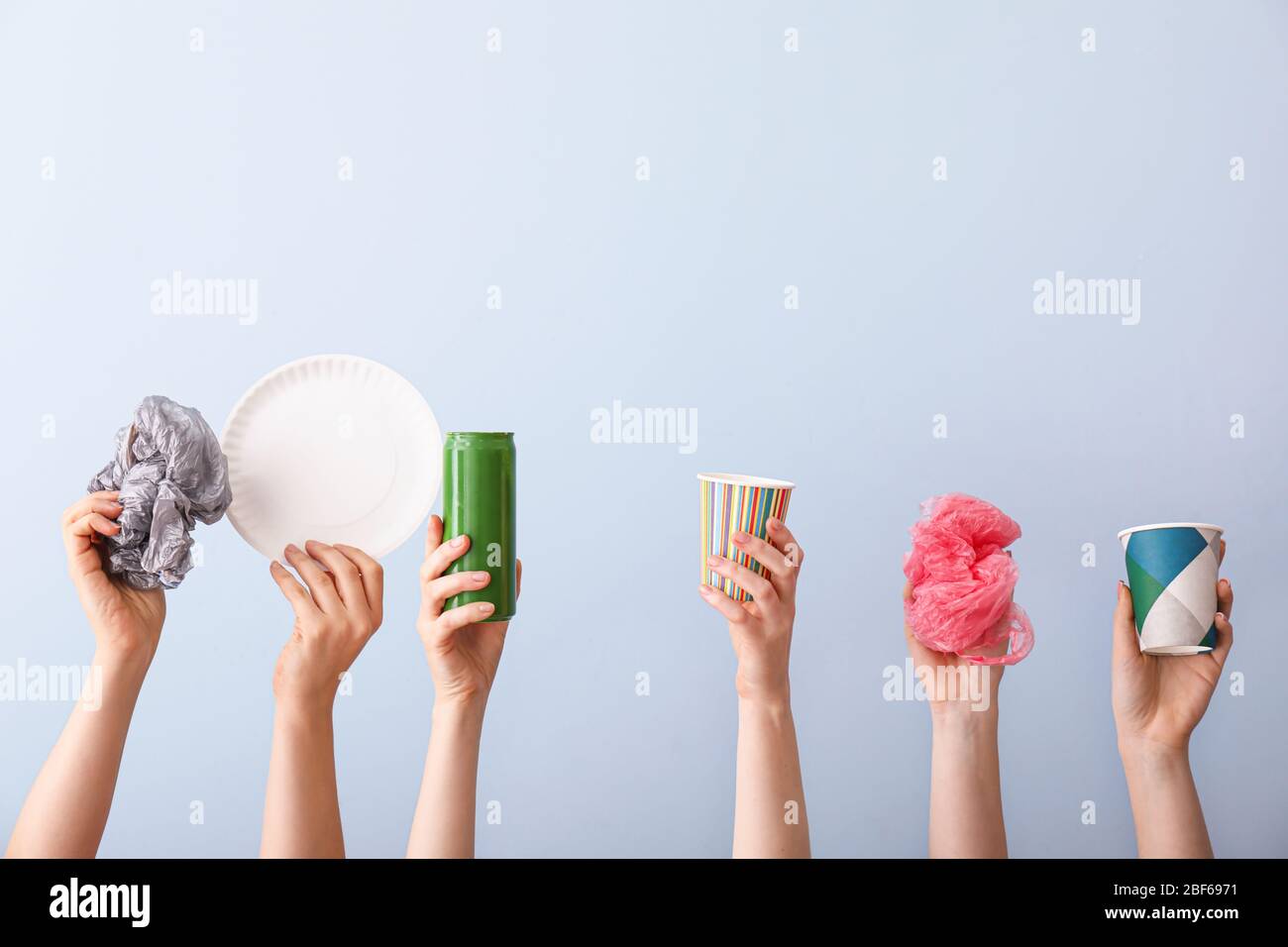 Hands with garbage on color background. Concept of recycling Stock ...