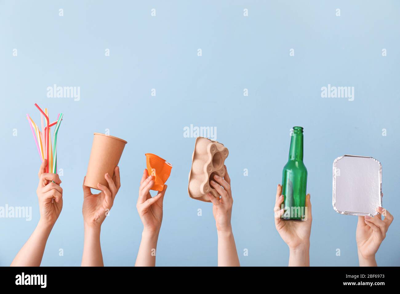 Hands with garbage on color background. Concept of recycling Stock ...