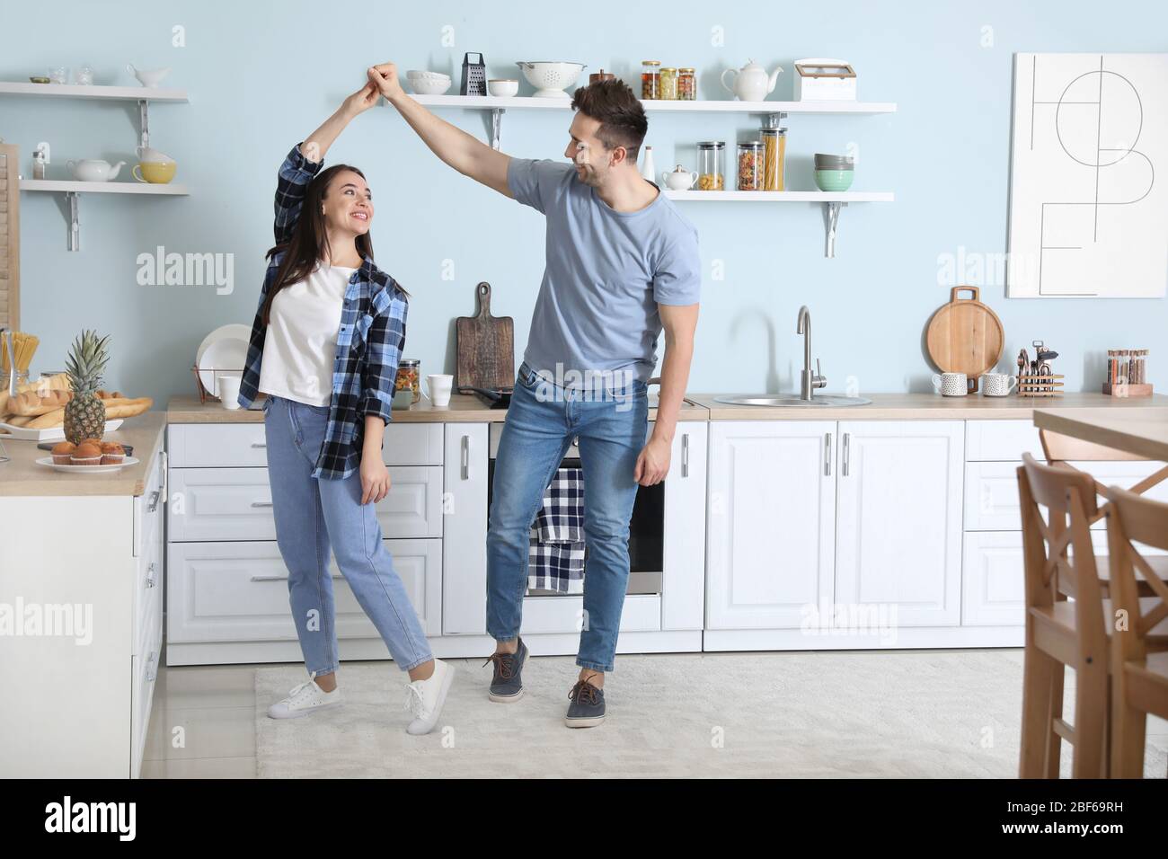 Couple dancing in kitchen hi-res stock photography and images - Alamy