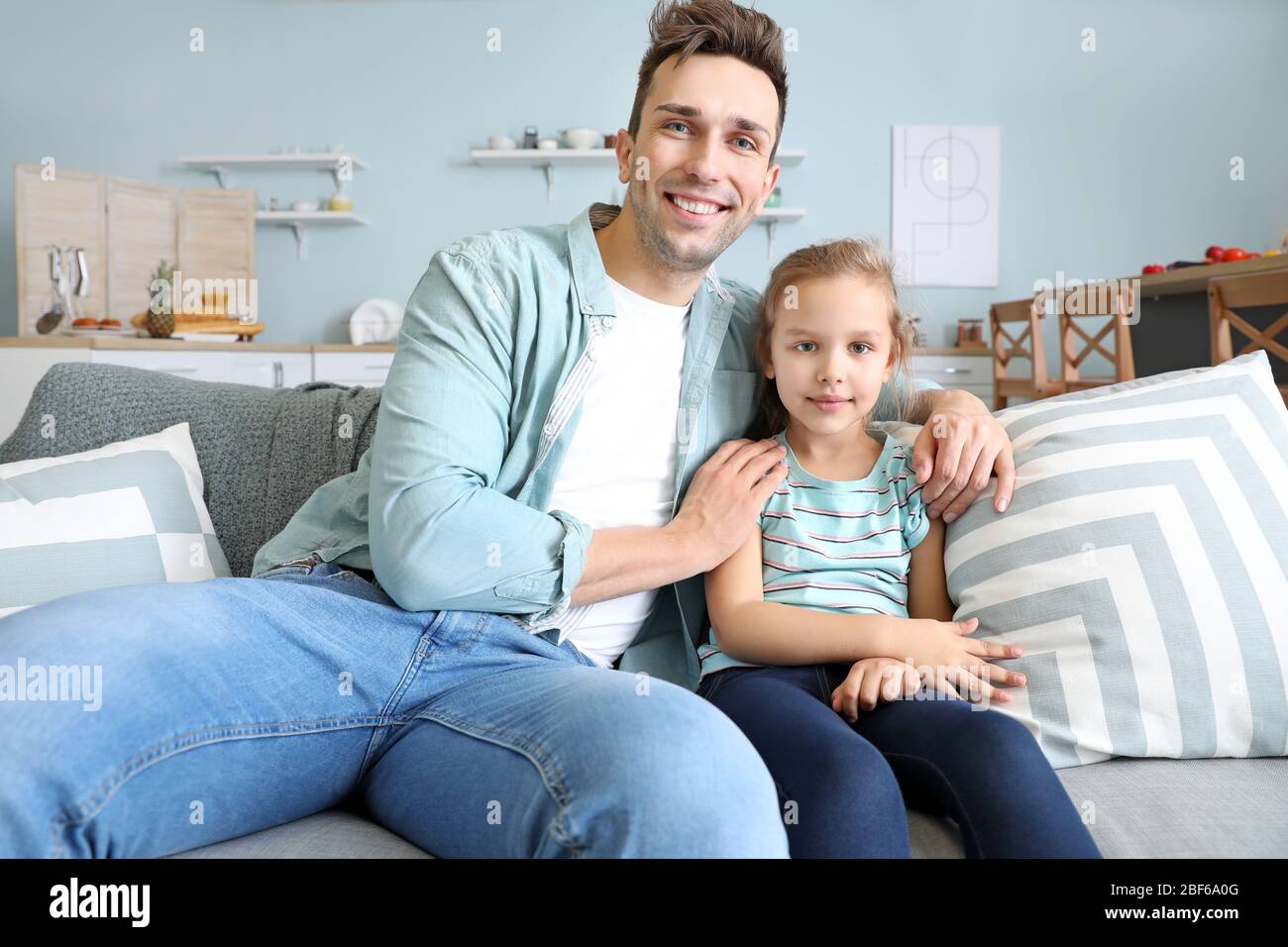 Young father with daughter having video call at home Stock Photo - Alamy