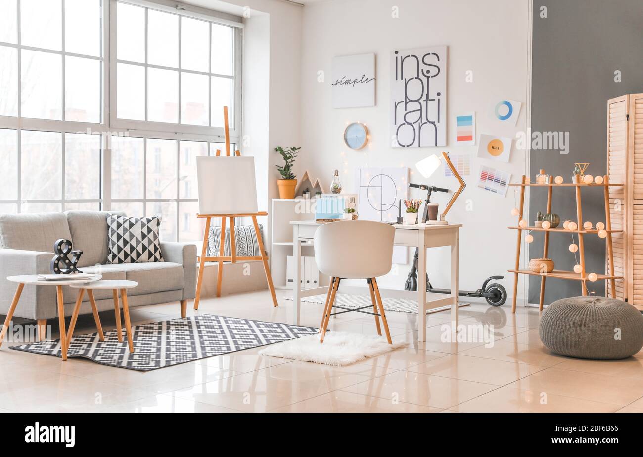 Interior of modern office with designer's workplace Stock Photo - Alamy