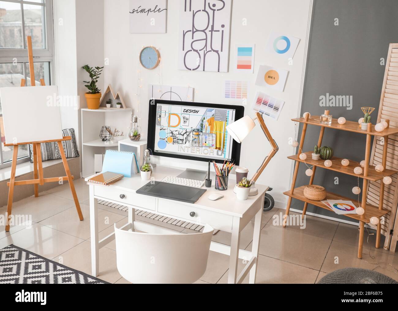 Interior of modern office with designer's workplace Stock Photo - Alamy