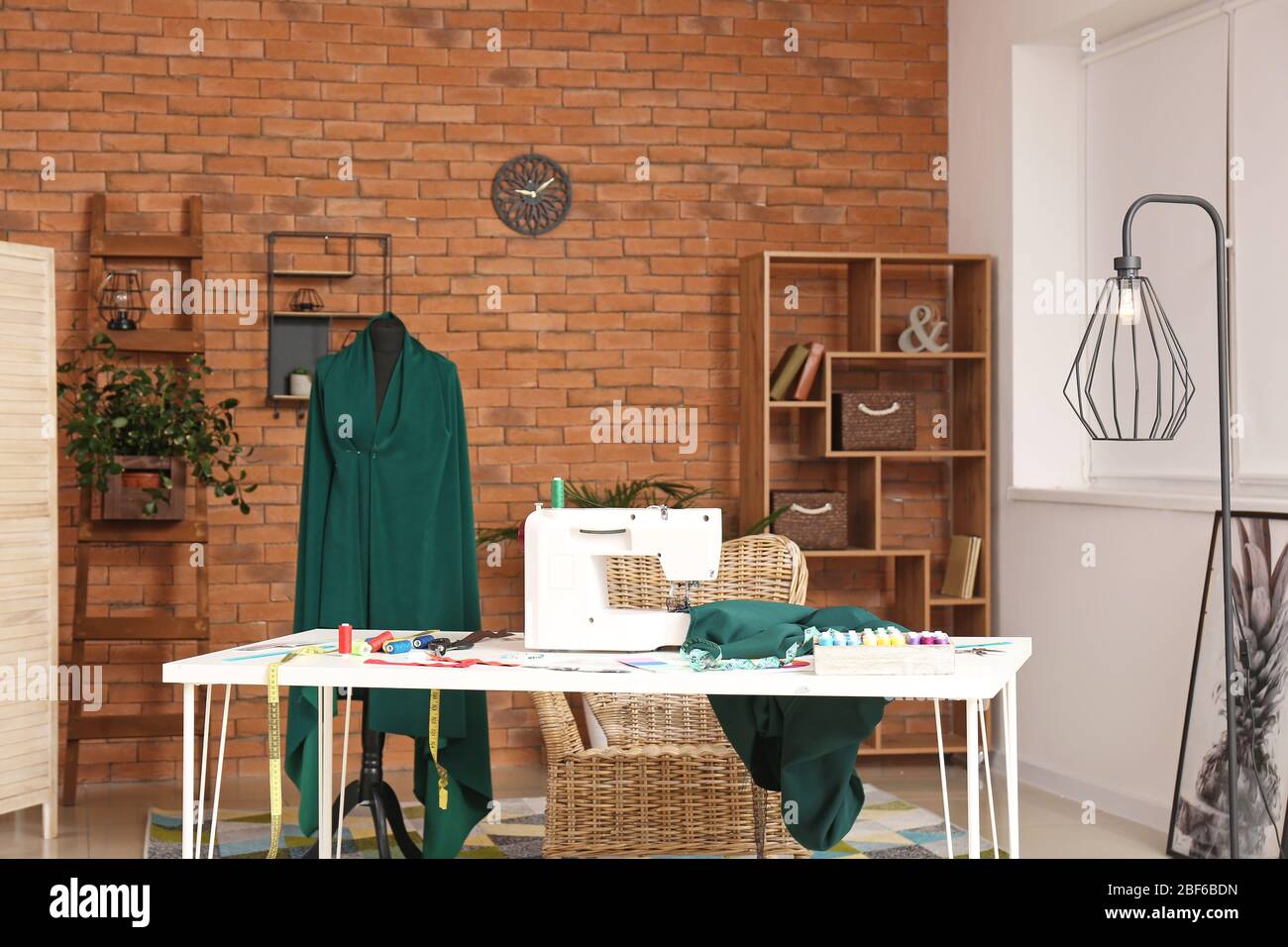 Interior of modern atelier with tailor's workplace Stock Photo - Alamy