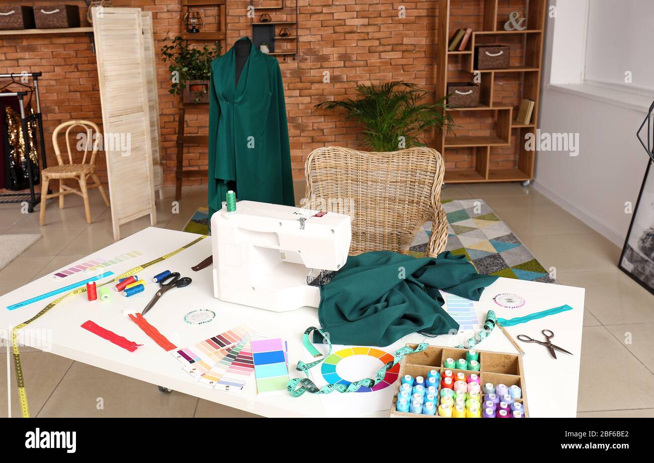 Interior of modern atelier with tailor's workplace Stock Photo - Alamy