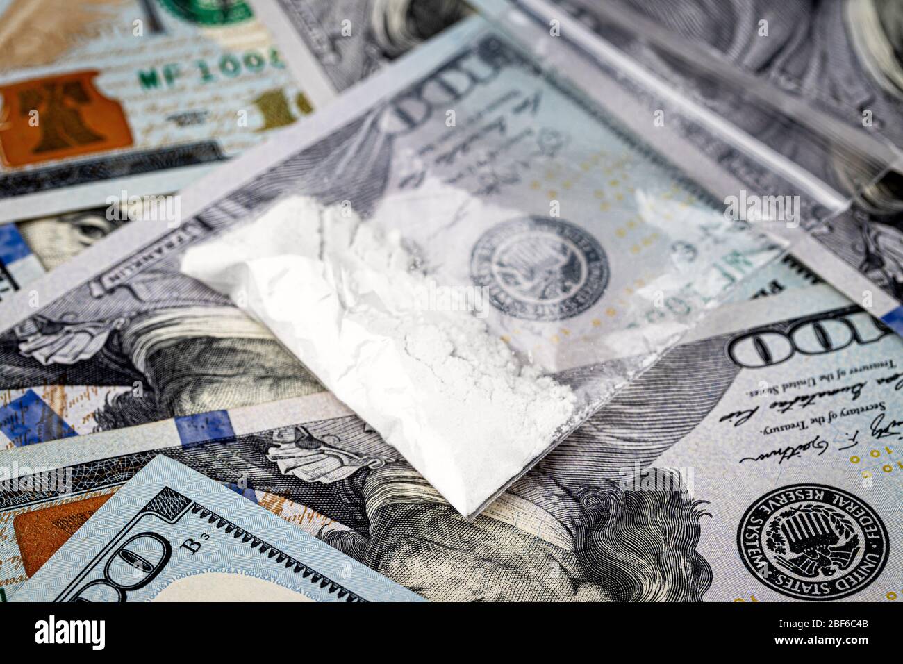 A bag with white narcotic powder like heroin or cocaine on the ...