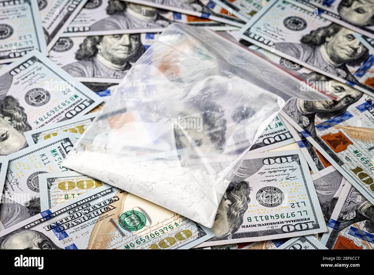 A bag with white narcotic powder like heroin or cocaine on the ...