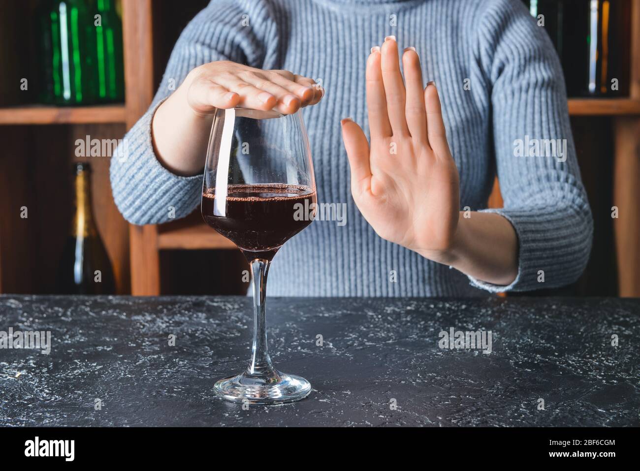 Woman refusing to drink wine in bar. Concept of alcoholism Stock Photo ... Woman refusing to drink wine in bar. Concept of alcoholism Stock Photo ...