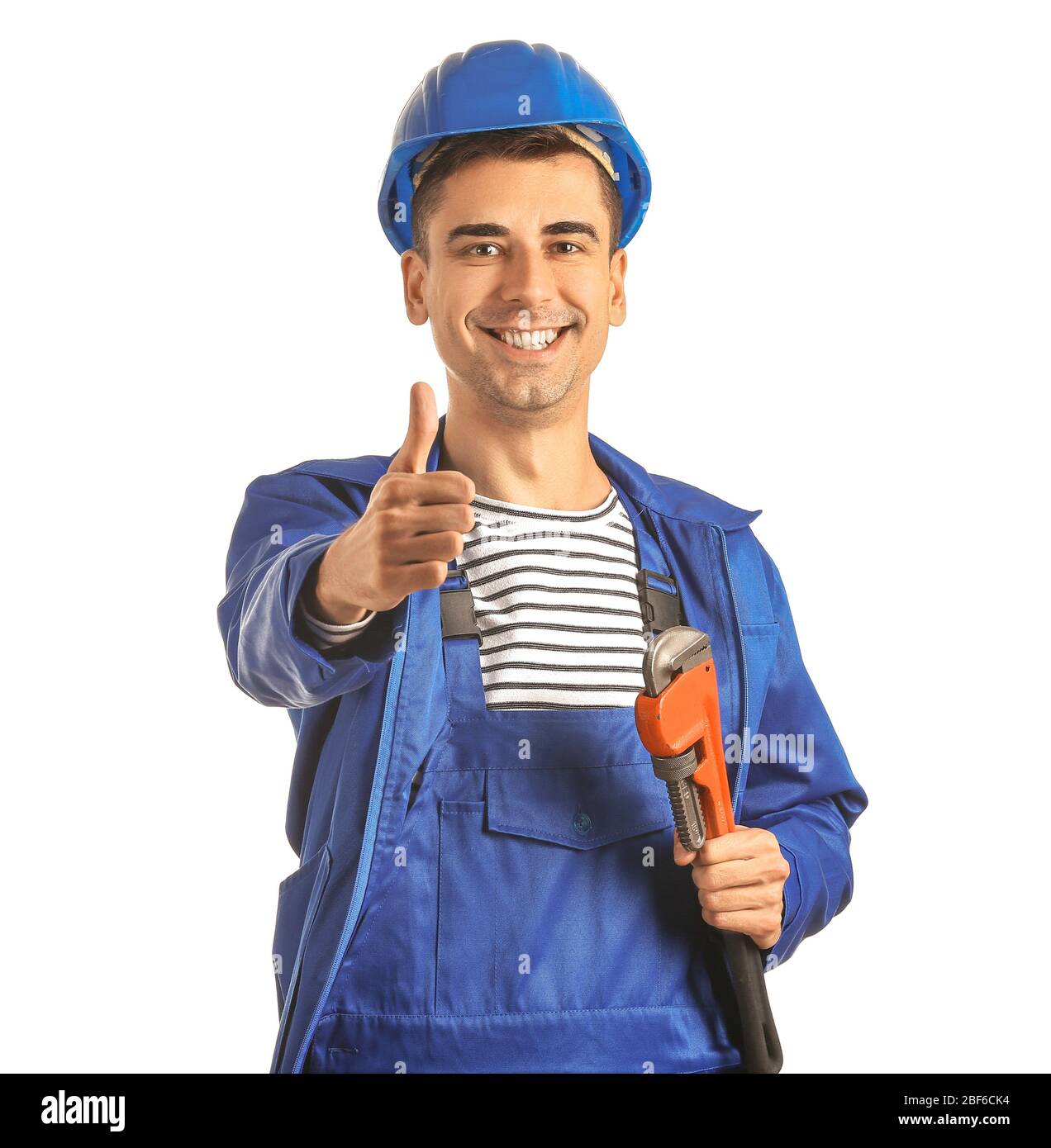 Handsome male worker showing thumb-up on white background Stock Photo ...