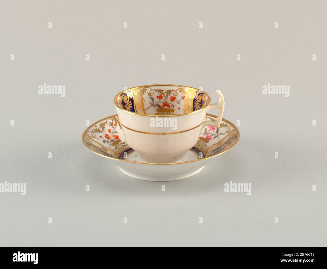 Cup and Saucer with Imari Pattern. Cup has handle with raised spur ...