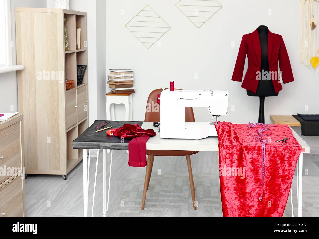 Interior of modern atelier with tailor's workplace Stock Photo - Alamy
