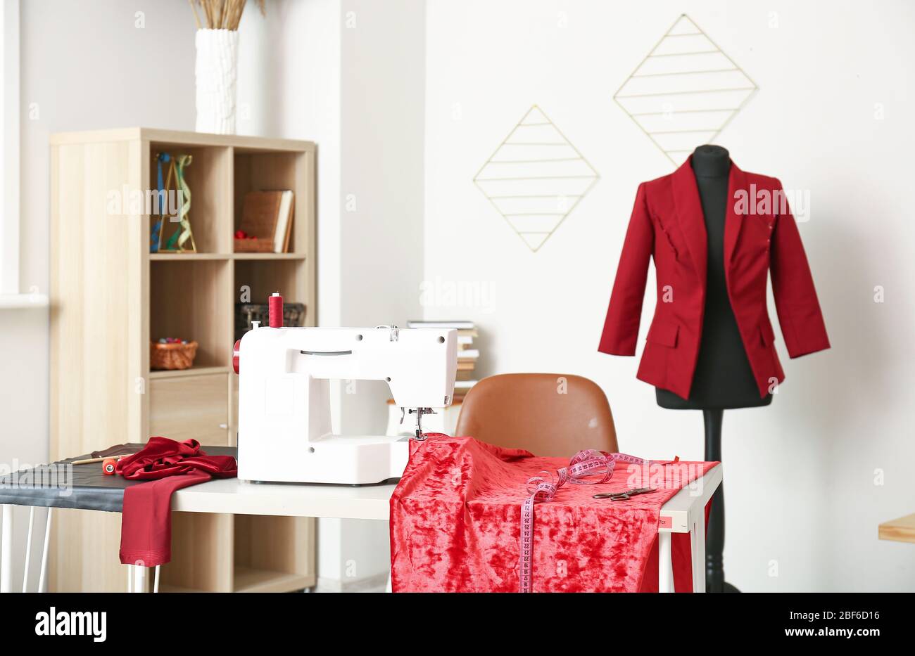 Interior of modern atelier with tailor's workplace Stock Photo - Alamy